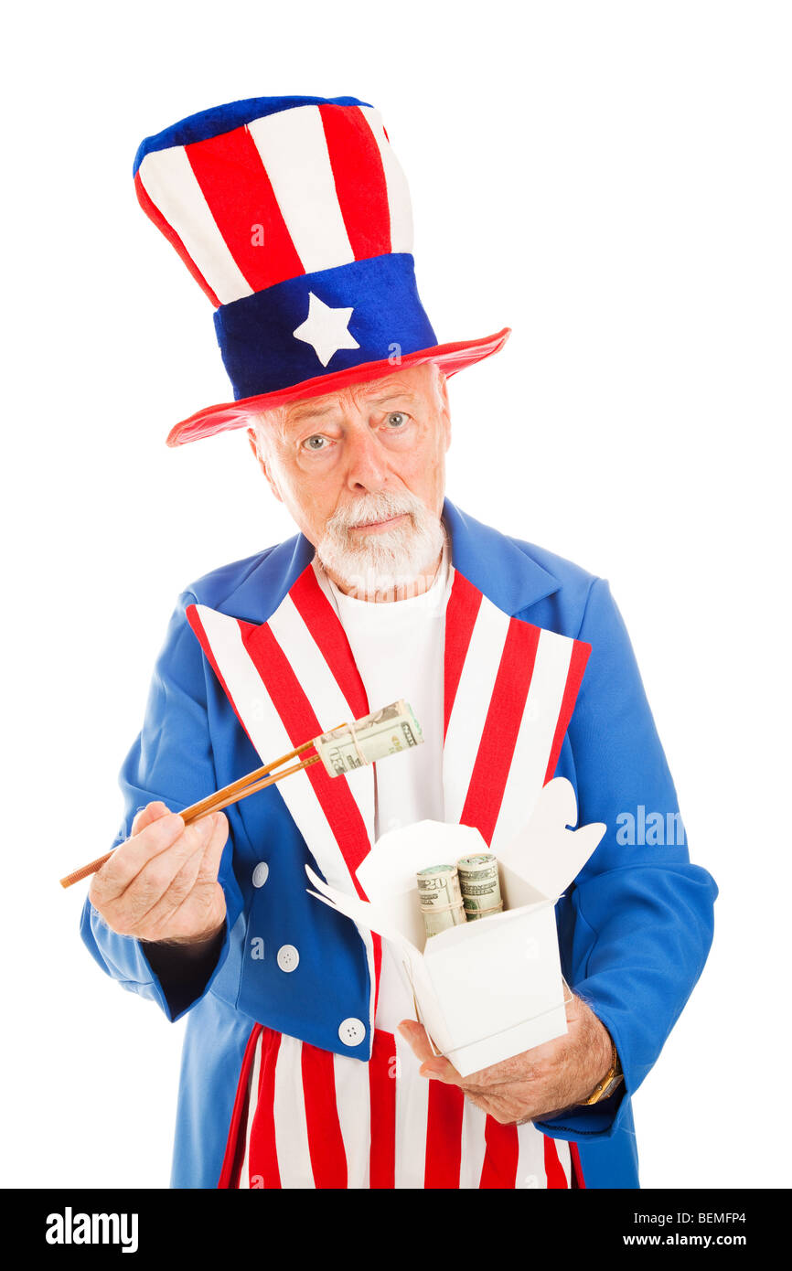 American Uncle Sam looks worried as he eats rolls of cash from a ...