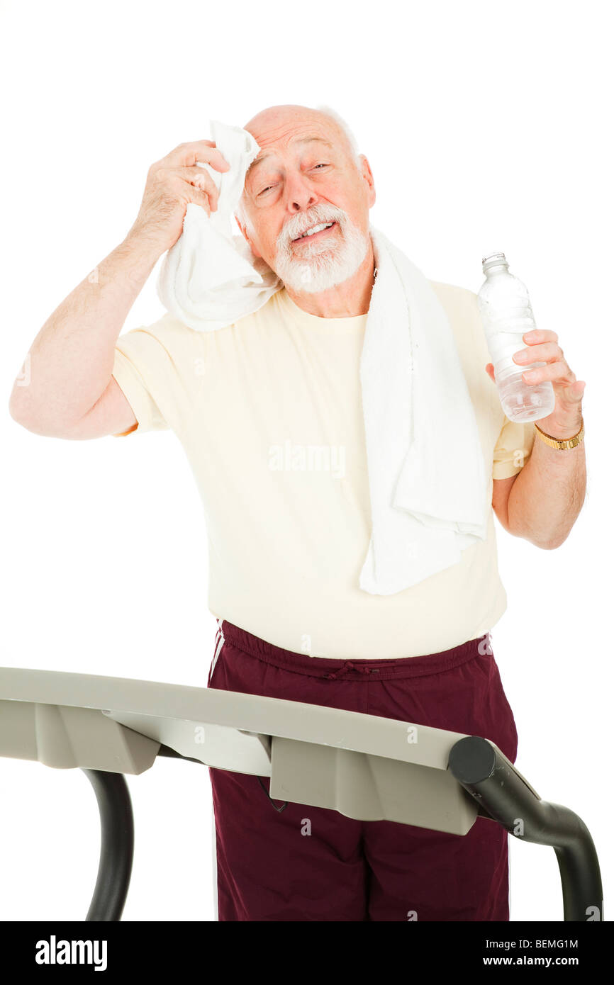 Fit healthy senior man takes a break from working out to cool down ...