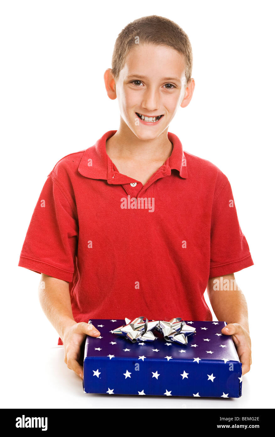 Cute little boy holding a holiday gift wrapped in star paper. Could be ...