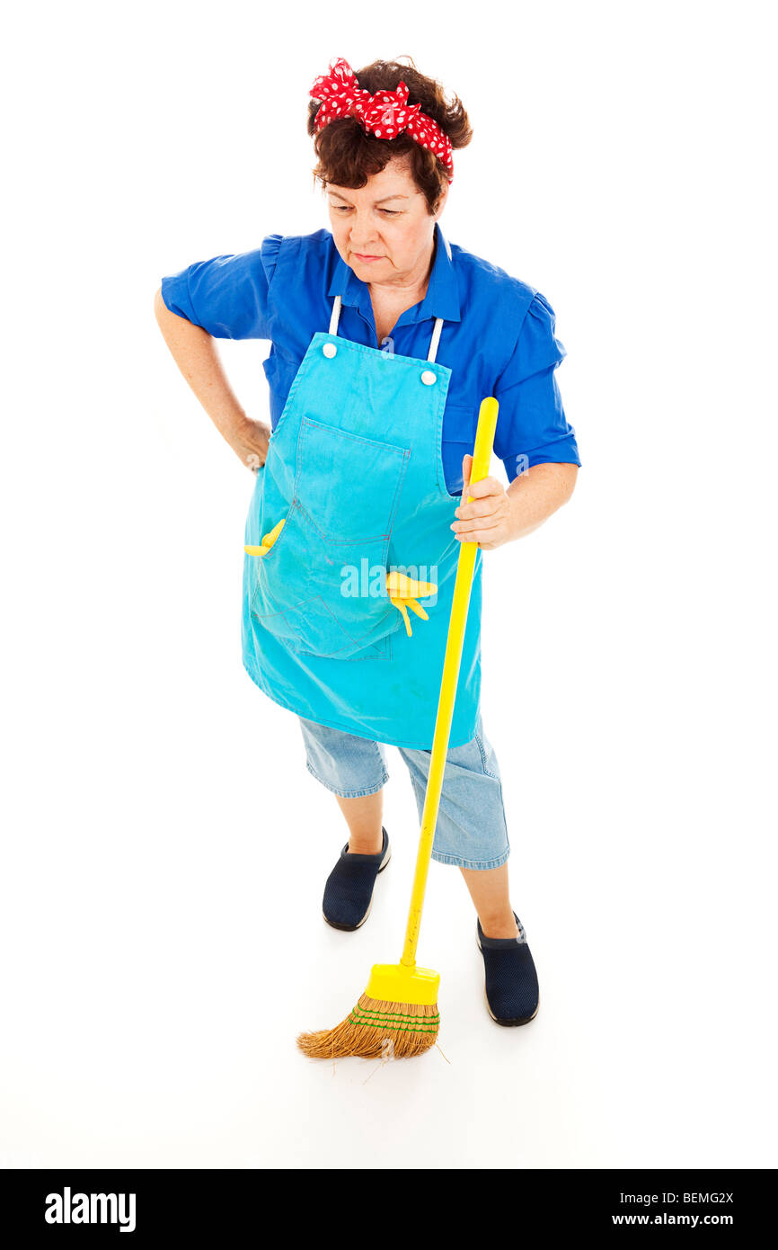 Maid looking sad as she sweeps the floor. Full body isolated Stock ...