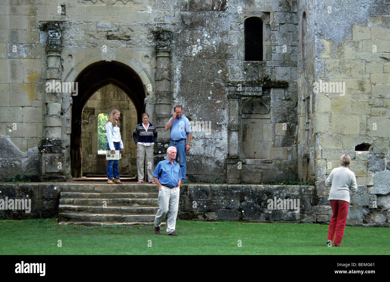 Tourists visiting the ruin of the Old Wardour Castle, Wiltshire, UK ...