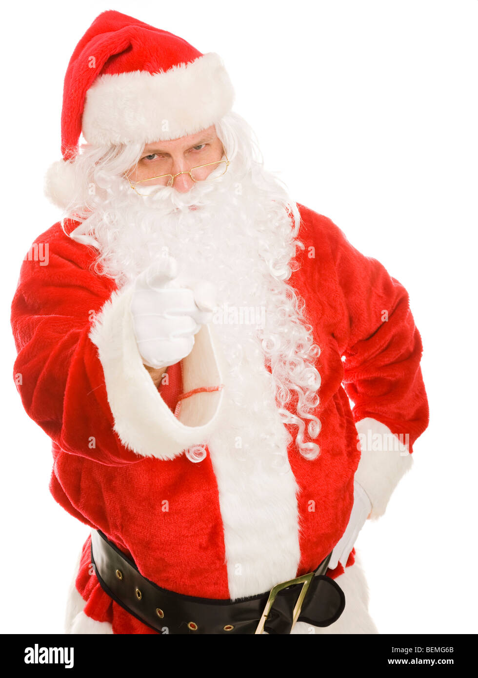 Santa is pointing his finger at the camera and looking stern. Isolated ...