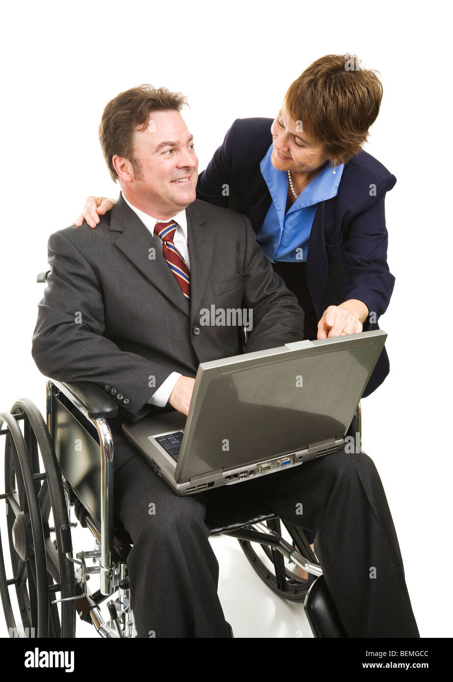 Disabled businessman uses a laptop computer with the help of a ...