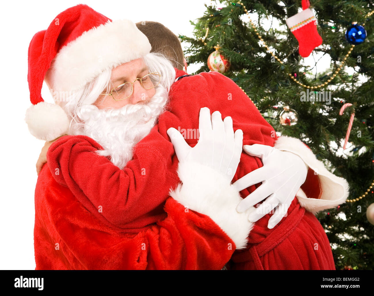 Santa getting a big hug from a child on Christmas morning Stock Photo ...