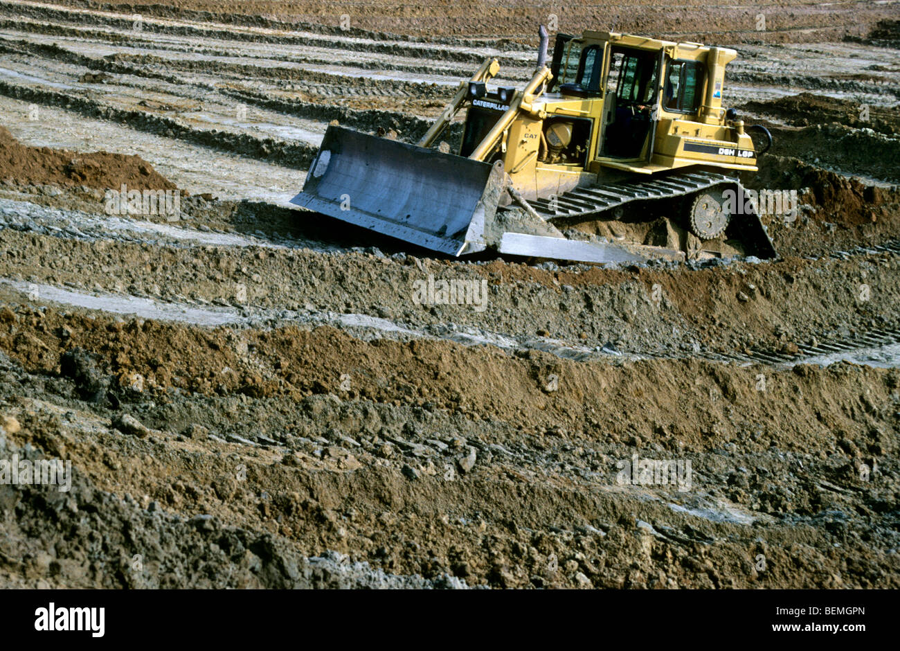 Navvy work done by bulldozer on construction site Stock Photo - Alamy