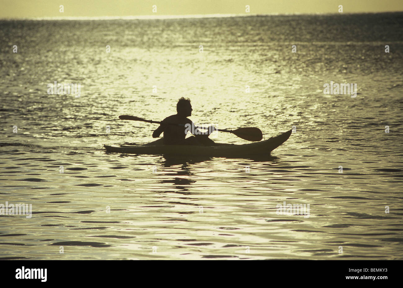 Kayaking in twilight. Moorea. French Polynesia Stock Photo - Alamy