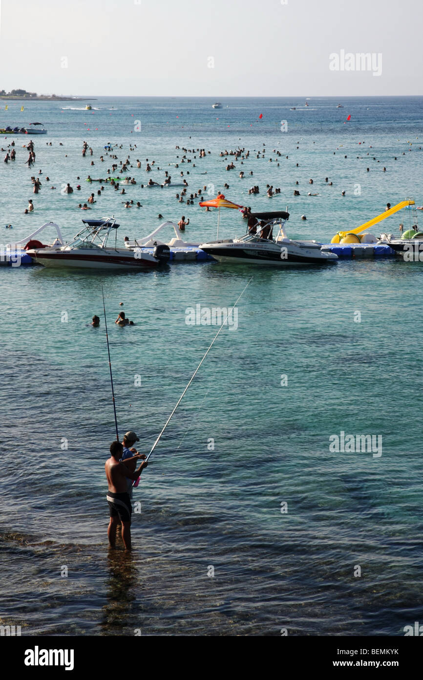 Two men beach fishing hi-res stock photography and images - Alamy