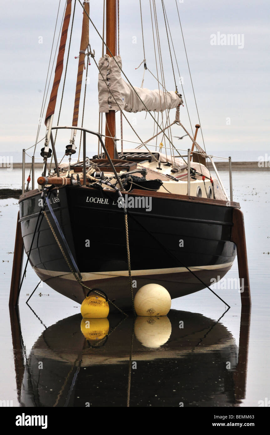 Yacht on beaching legs at low tide, Newport, Pembrokeshire, Wales Stock ...