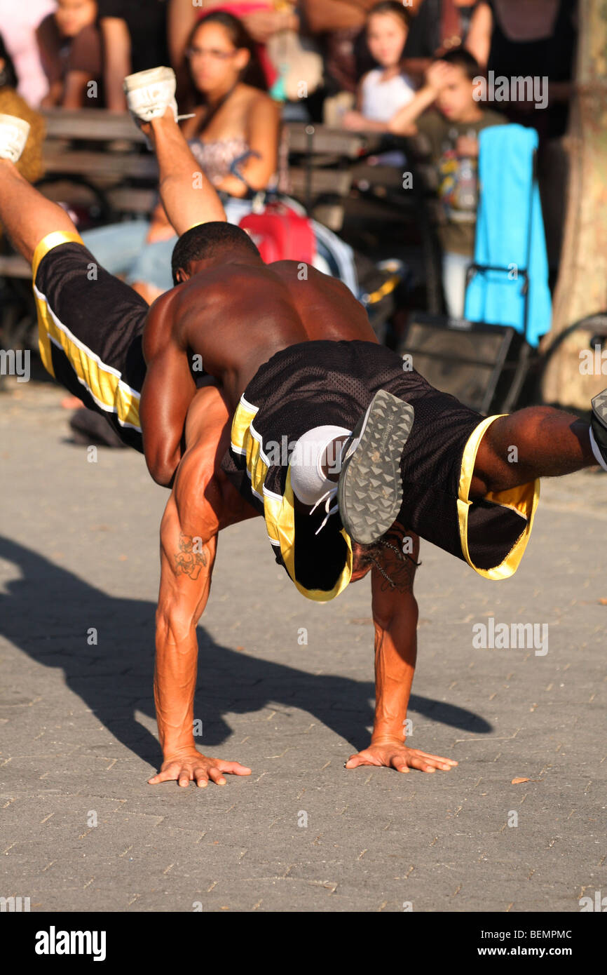 Acrobats in Battery Park New York. Street dances performing in the park ...