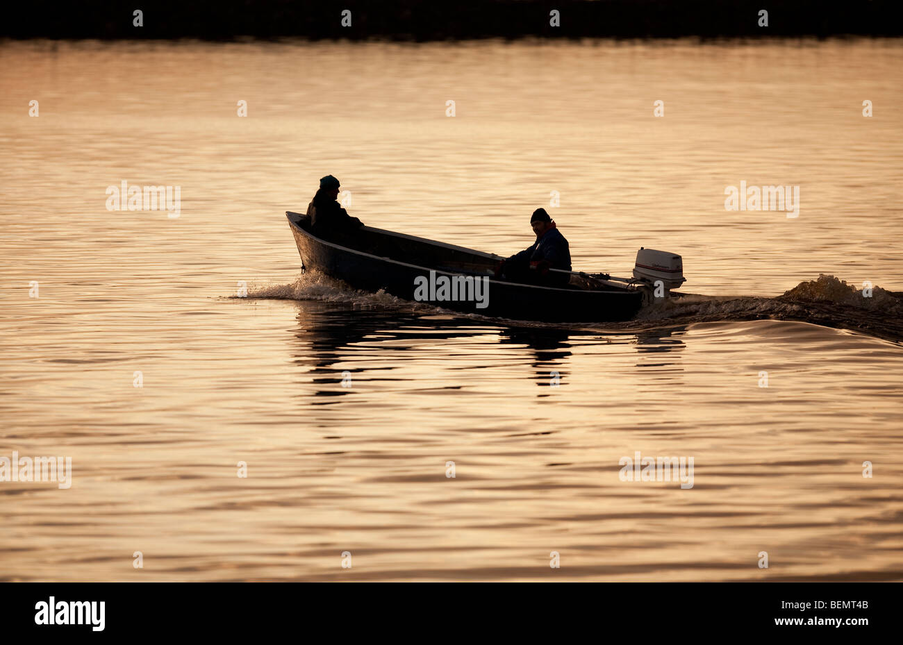 Fishing boat heading sunset hi-res stock photography and images - Alamy