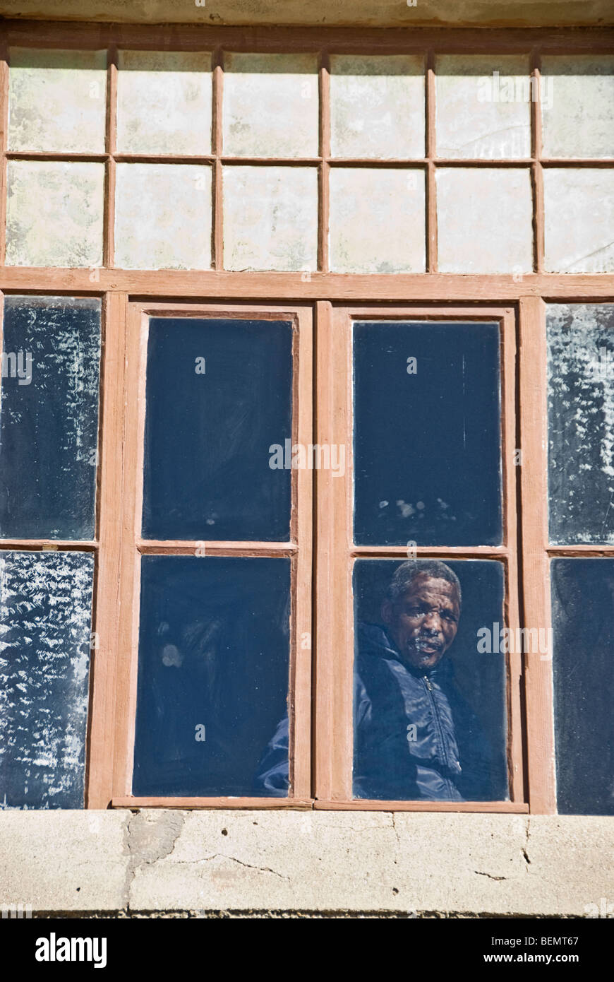 Man looking trough the window. Ghost town of Kolmanskoppe, in the ...