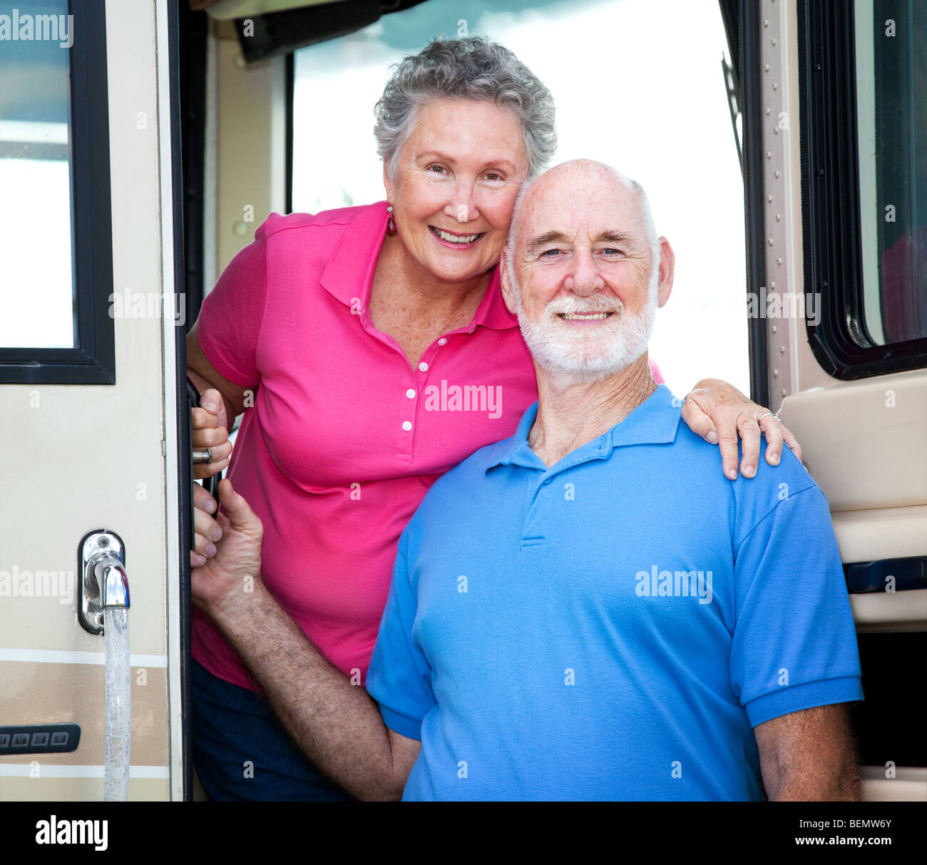 Portrait of senior couple at the door of their luxury RV Stock Photo ...