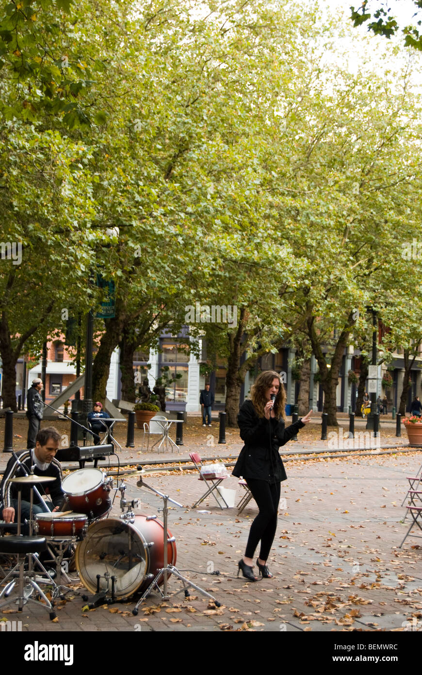 A band performs in Seattle's Occidental Square Stock Photo - Alamy