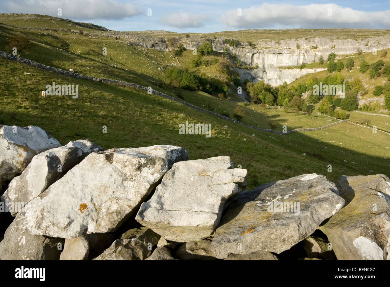 A view of Malham Cove, a huge limestone cliff in the Yorkshire Dales ...