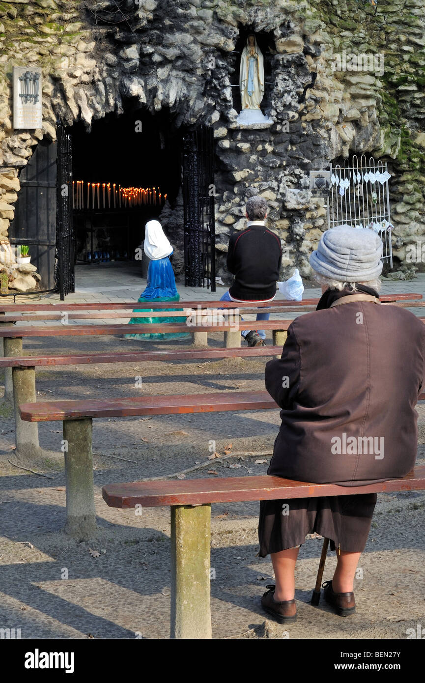 People praying at the Lourdes grotto, Oostakker-Lourdes place of ...