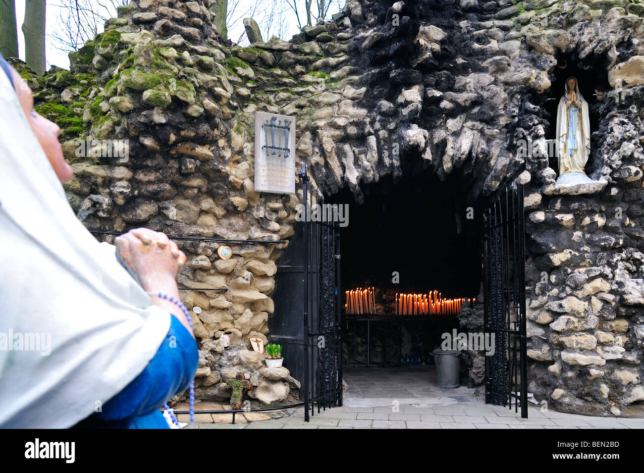 Statue of praying Bernadette Soubirous at the Lourdes grotto, Oostakker-Lourdes place of ...