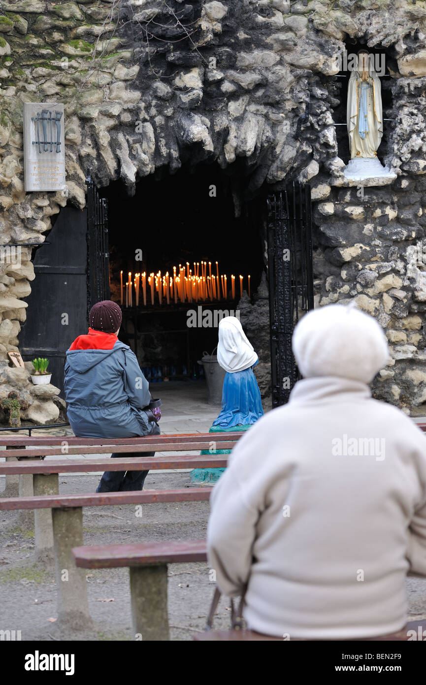 People praying at the Lourdes grotto, Oostakker-Lourdes place of ...