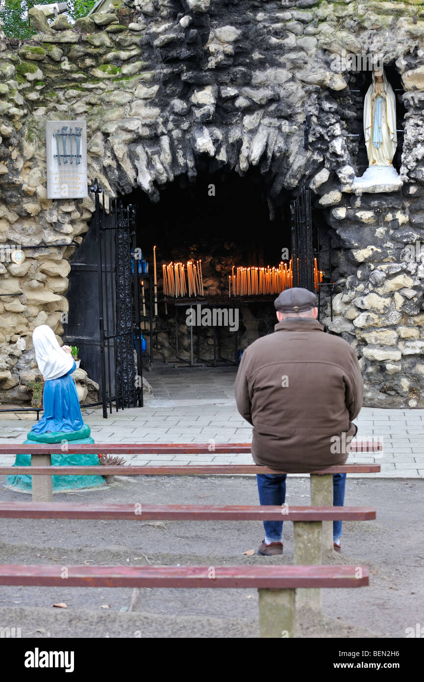People praying at the Lourdes grotto, Oostakker-Lourdes place of ...