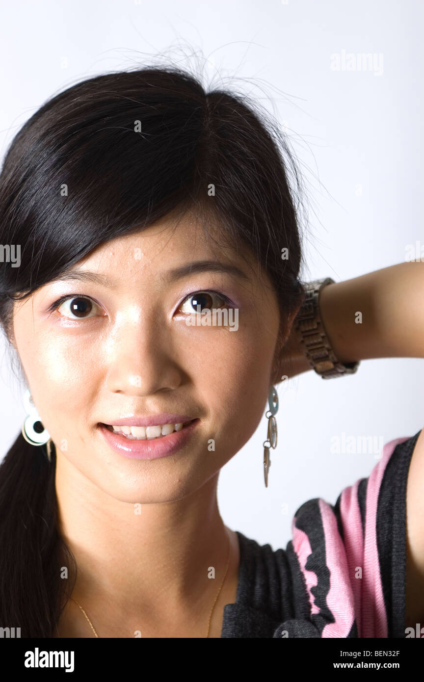 Pretty Asian model, young teenager, student from China. Girl with kind ...