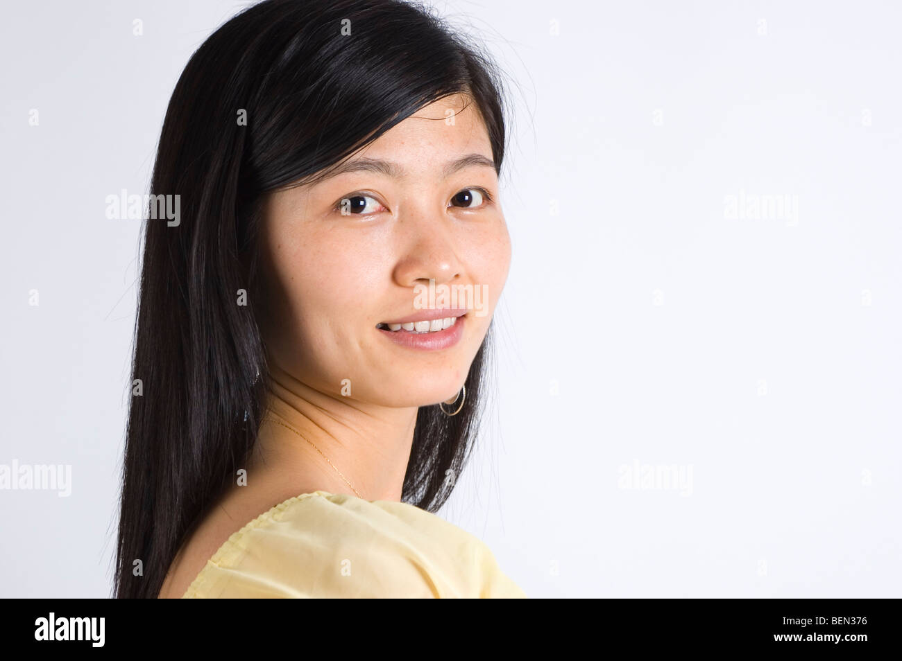 Pretty Asian model, young teenager, student from China. Girl with kind ...