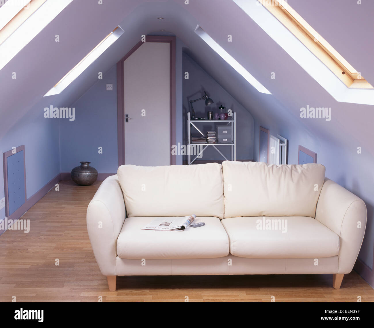 White sofa in small blue living room in modern loft conversion with ...