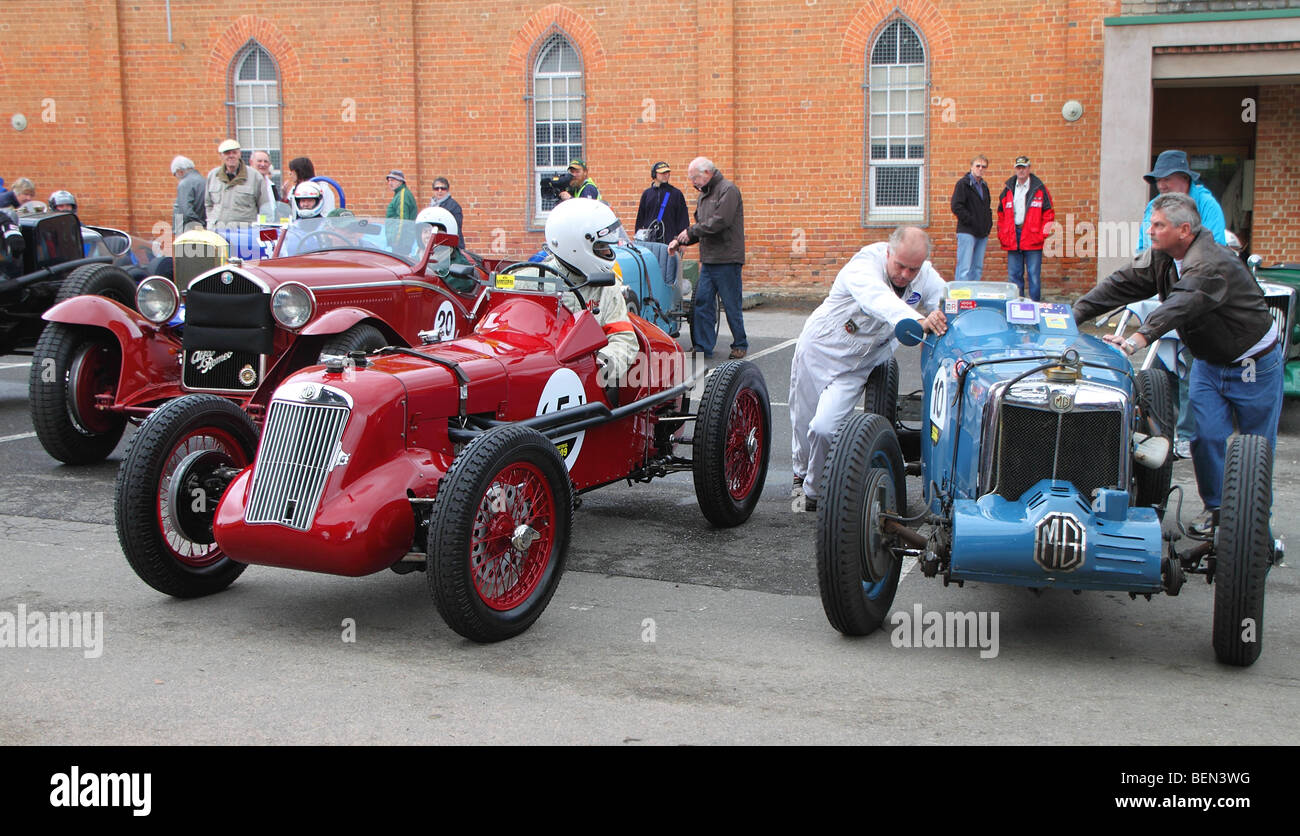 In the pit area - various classic and antique racing cars Stock Photo ...