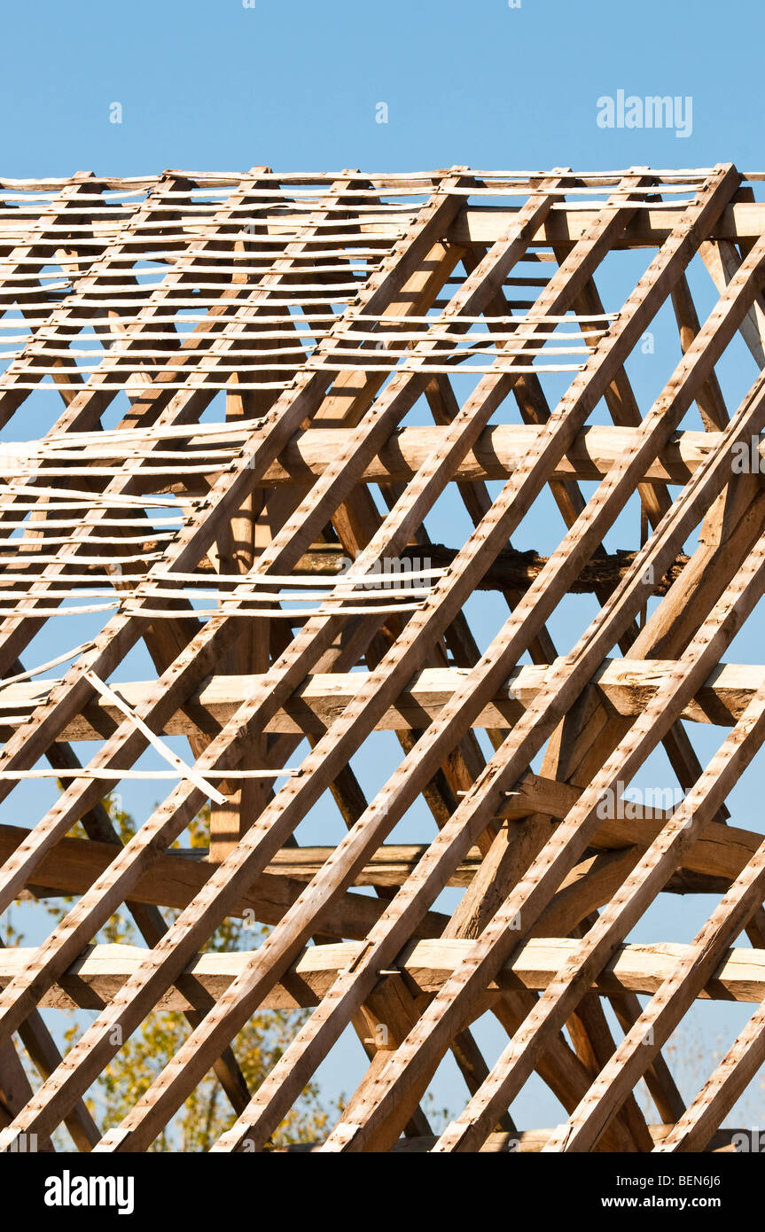 Storm damaged barn roof with tiles missing - France Stock Photo - Alamy