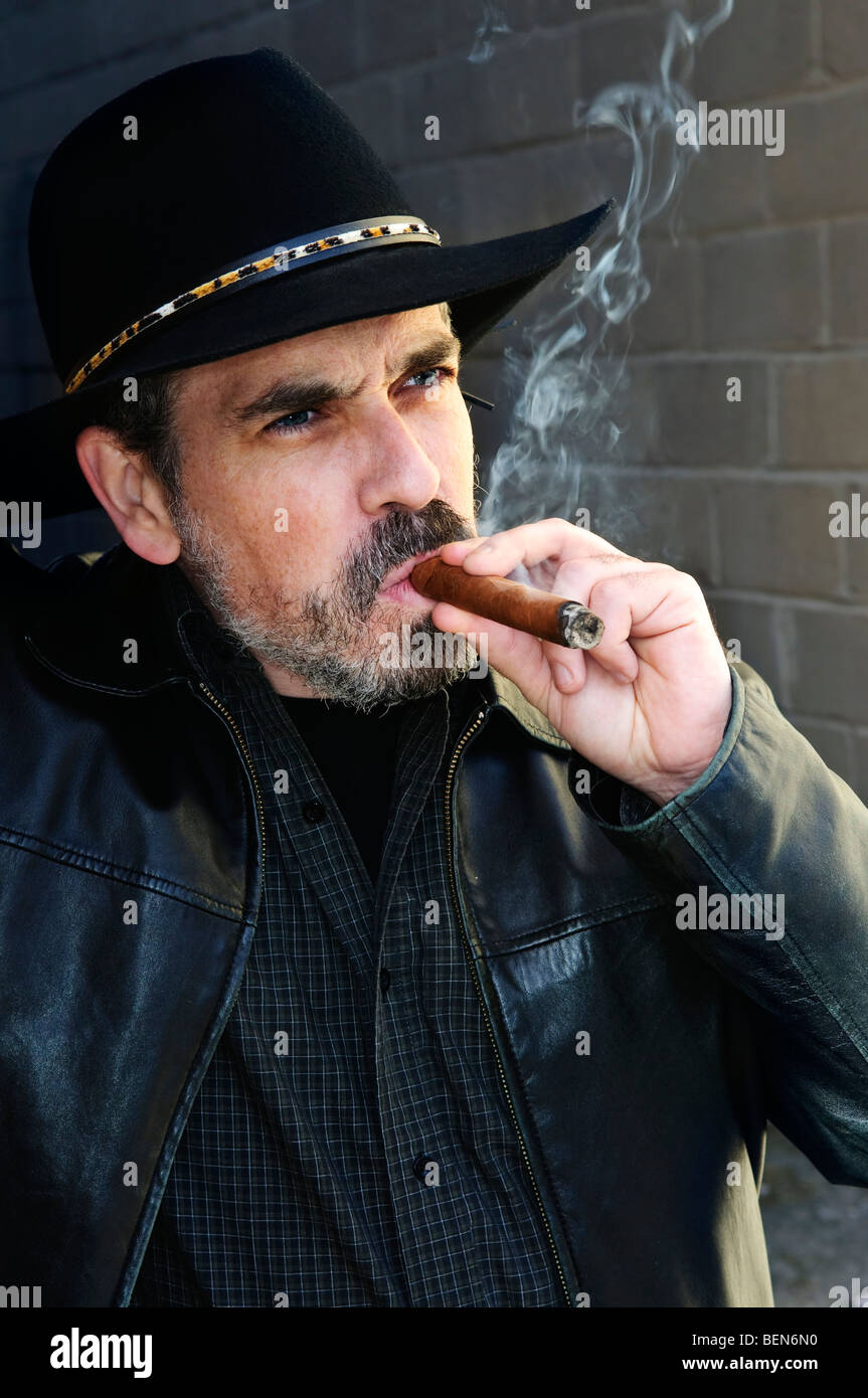 Cowboy smoking cigar hi-res stock photography and images - Alamy