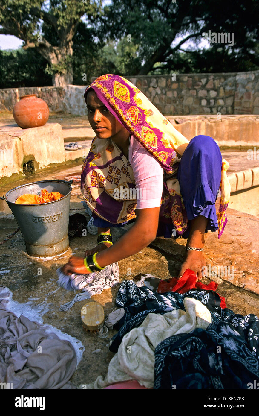 Woman doing the laundry at well in Jatoli, India Stock Photo - Alamy