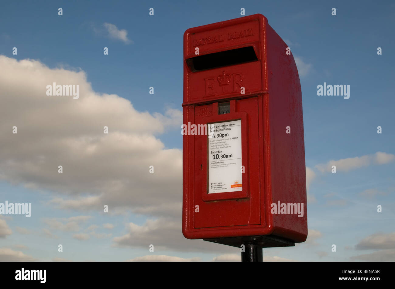 A modern British Royal Mail post box, with the sky behind it ...