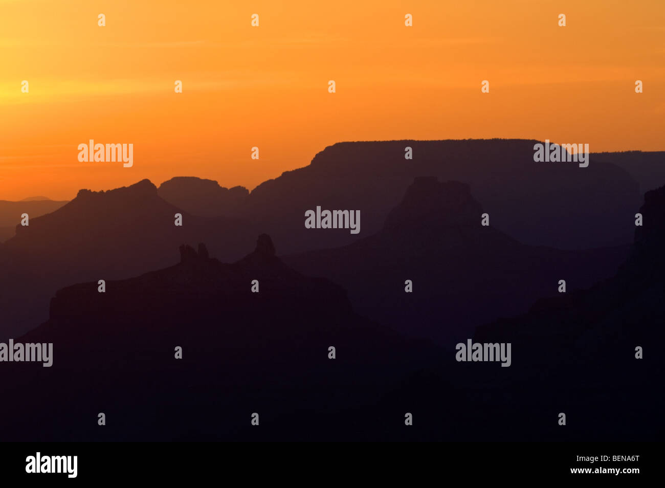 Silhouetted rock ridges at the eroded Grand Canyon carved by Colorado ...