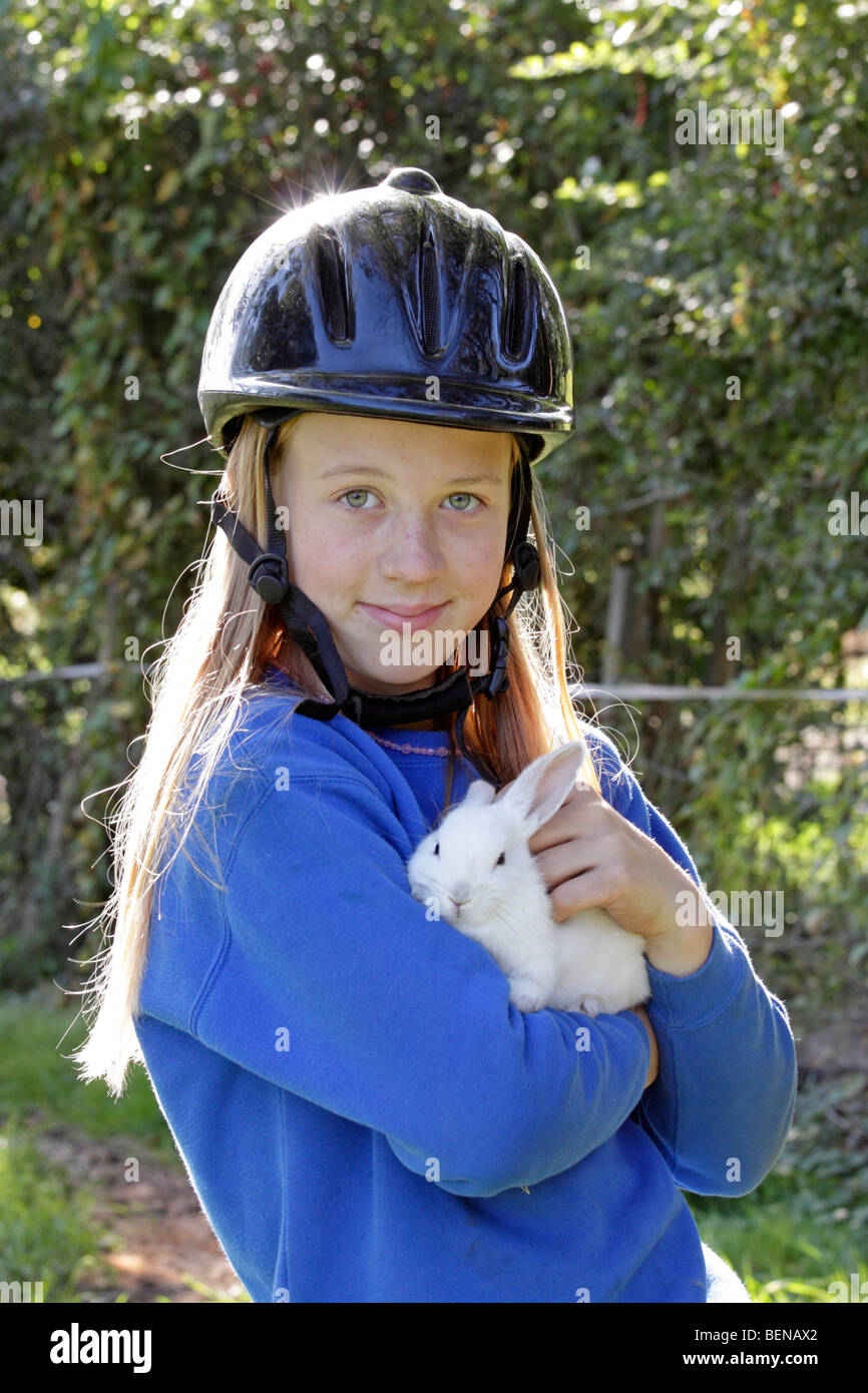 portrait of a young girl holding her pet in her arms Stock Photo - Alamy