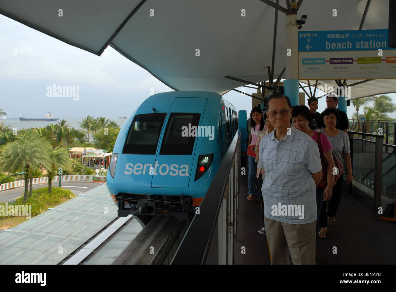 people arriving on Sentosa Express light railway at Beach Station ...