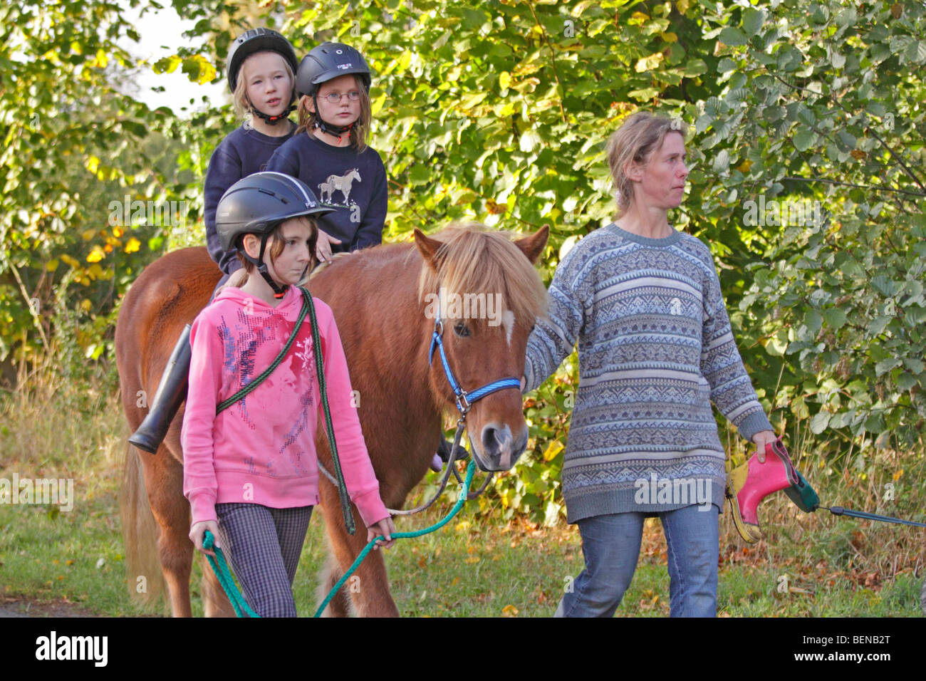 children riding their ponies Stock Photo - Alamy