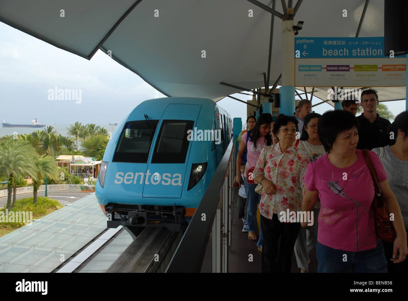 people arriving on Sentosa Express light railway at Beach Station ...