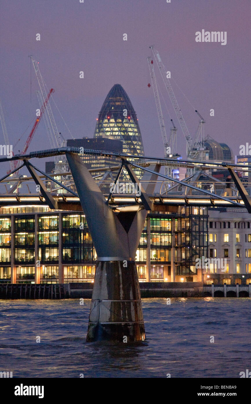 The Millennium Bridge, Swiss Re Gherkin building and the River Thames ...