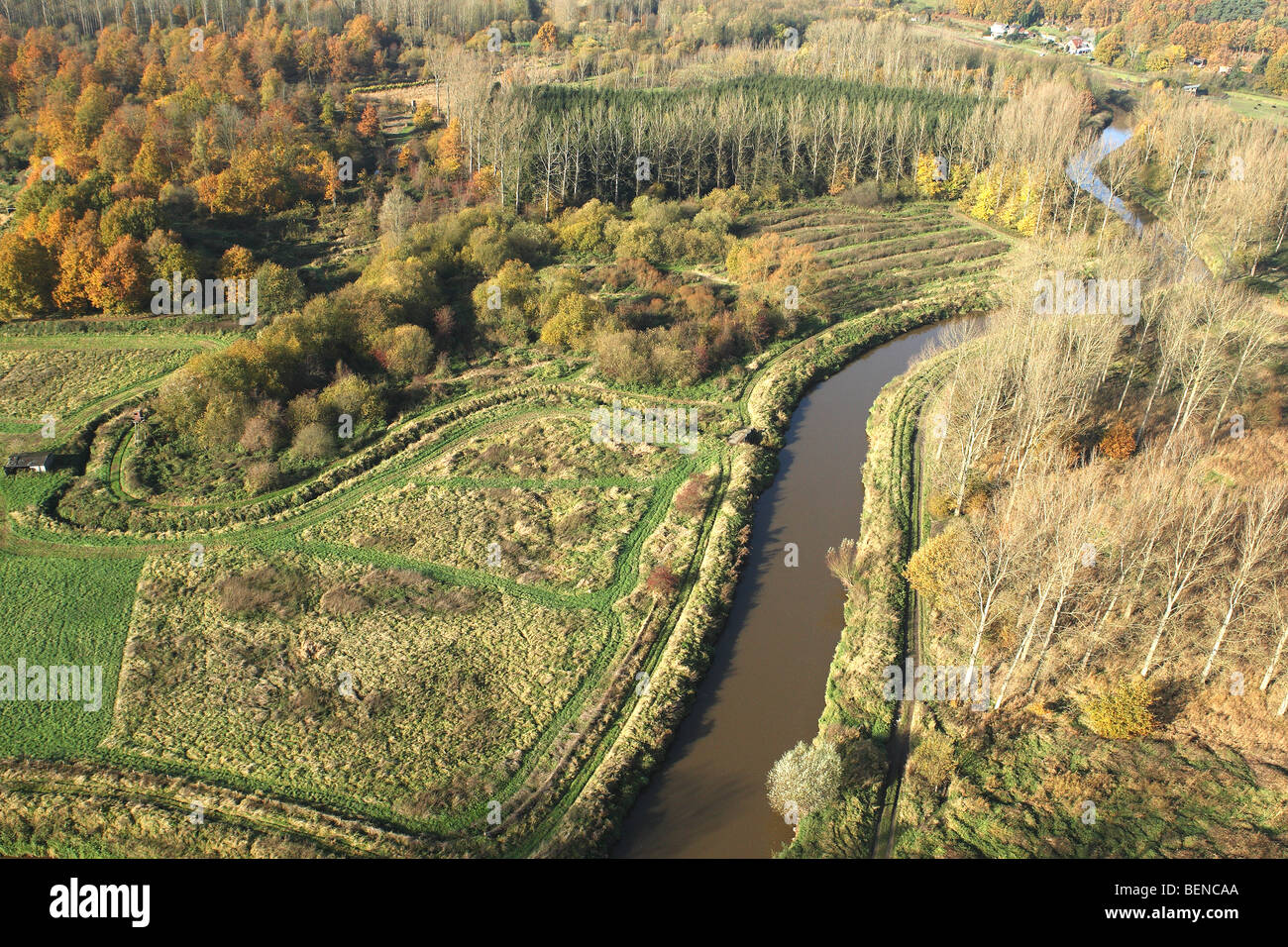 Fields, grasslands, forested area along river Demer from the air in ...