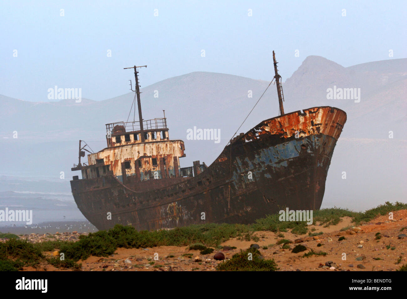 Shipwrecked boat in the mist along the Moroccan coast, Morocco, North ...