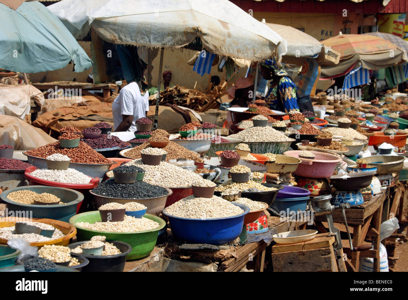 Basins and bowls with spices and food ingredients on display at market ...