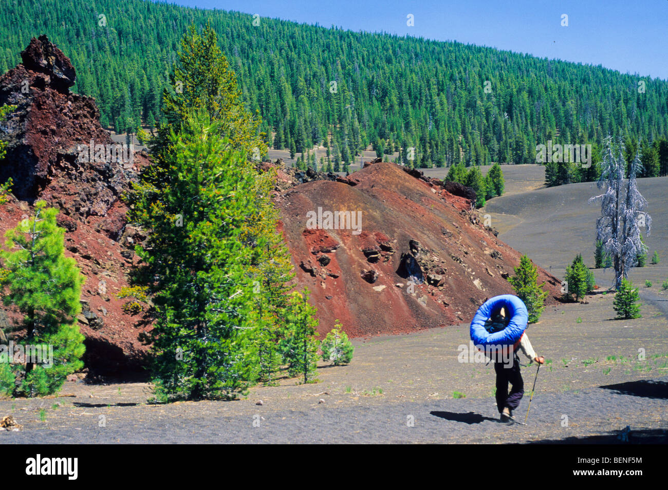 Man backpacking with float tube Stock Photo - Alamy