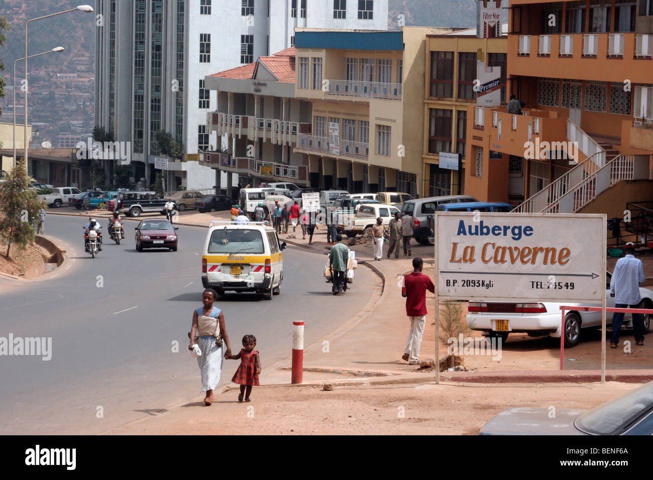 Traffic and pedestrians in street of Kigali, capital city of Rwanda ...