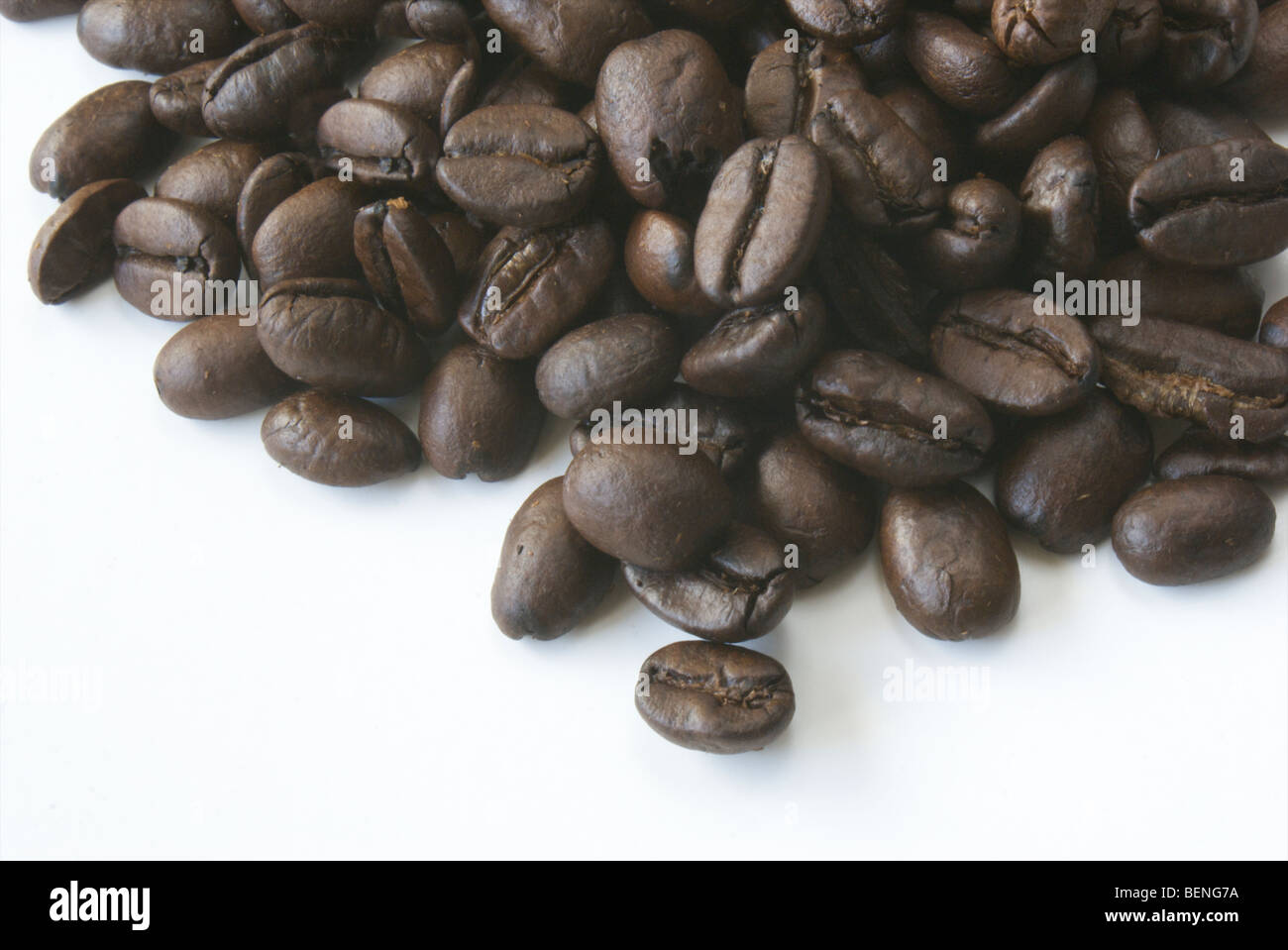 Coffee beans spread out on a white background Stock Photo - Alamy