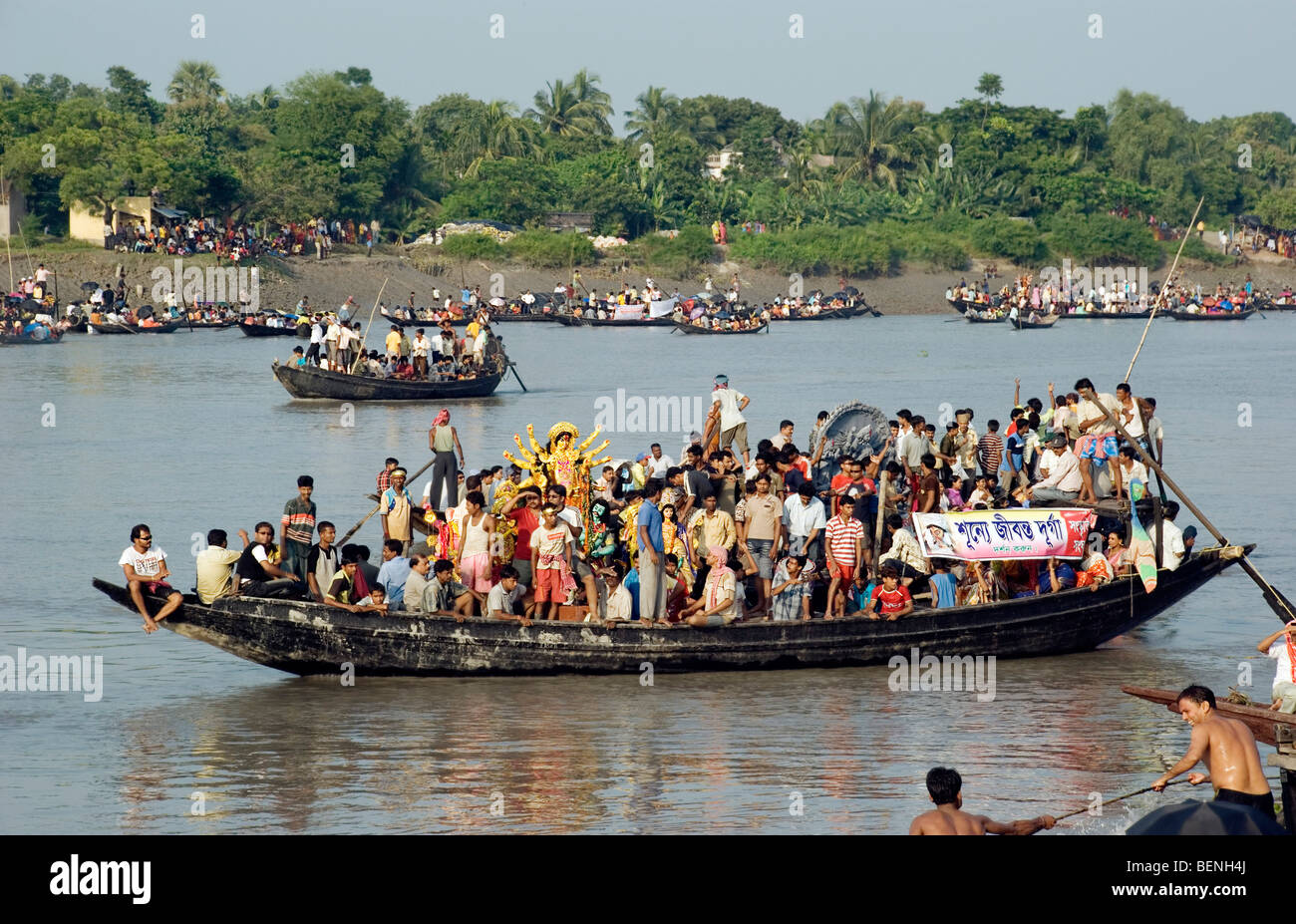 People in country boats on the occasion of Durga idol immersion in ...