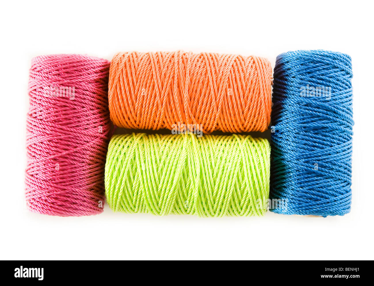 four colorful cord spools Stock Photo - Alamy