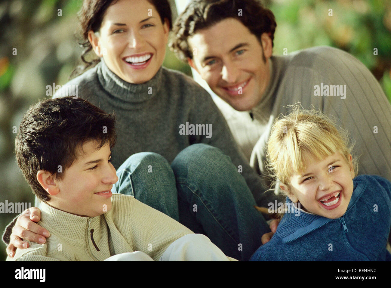 Family laughing together outdoors Stock Photo - Alamy