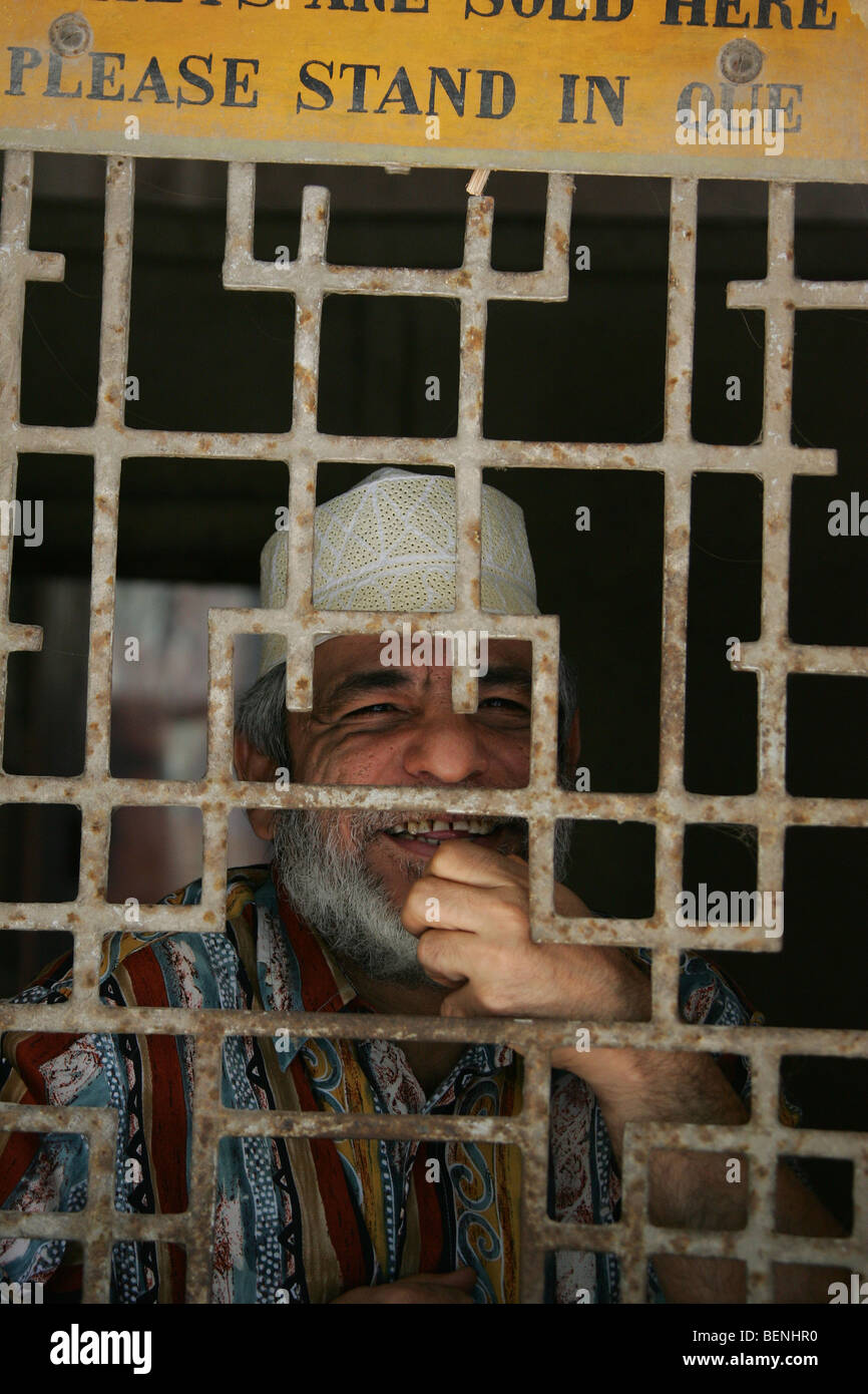 Man inside a ticket booth in Stonetown on the island Zanzibar in ...