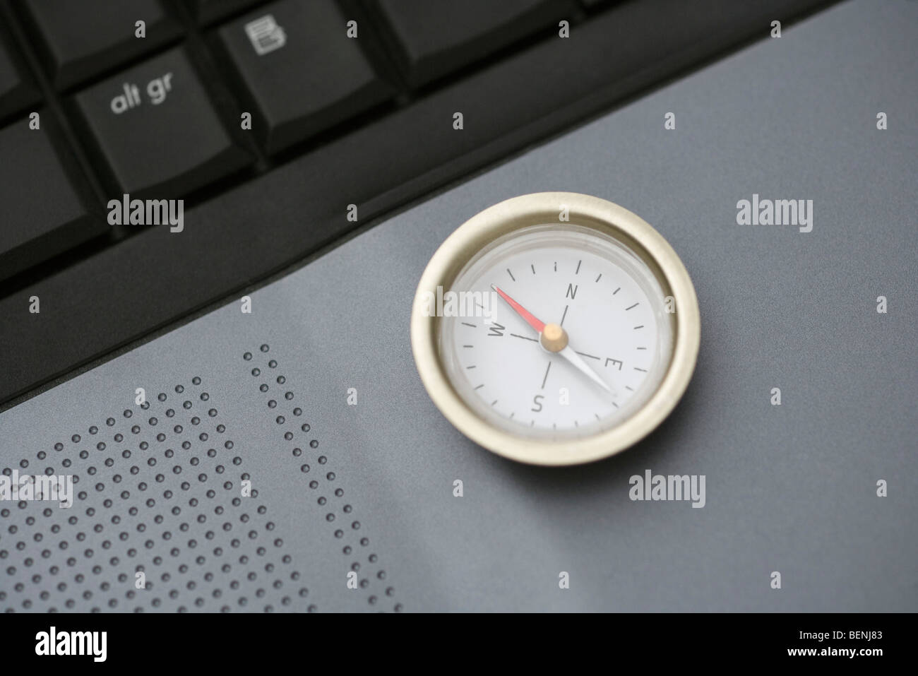 Compass on laptop computer, close-up Stock Photo - Alamy