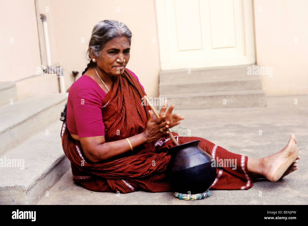 Old woman churning curd Chettinad Tamil Nadu India Stock Photo - Alamy