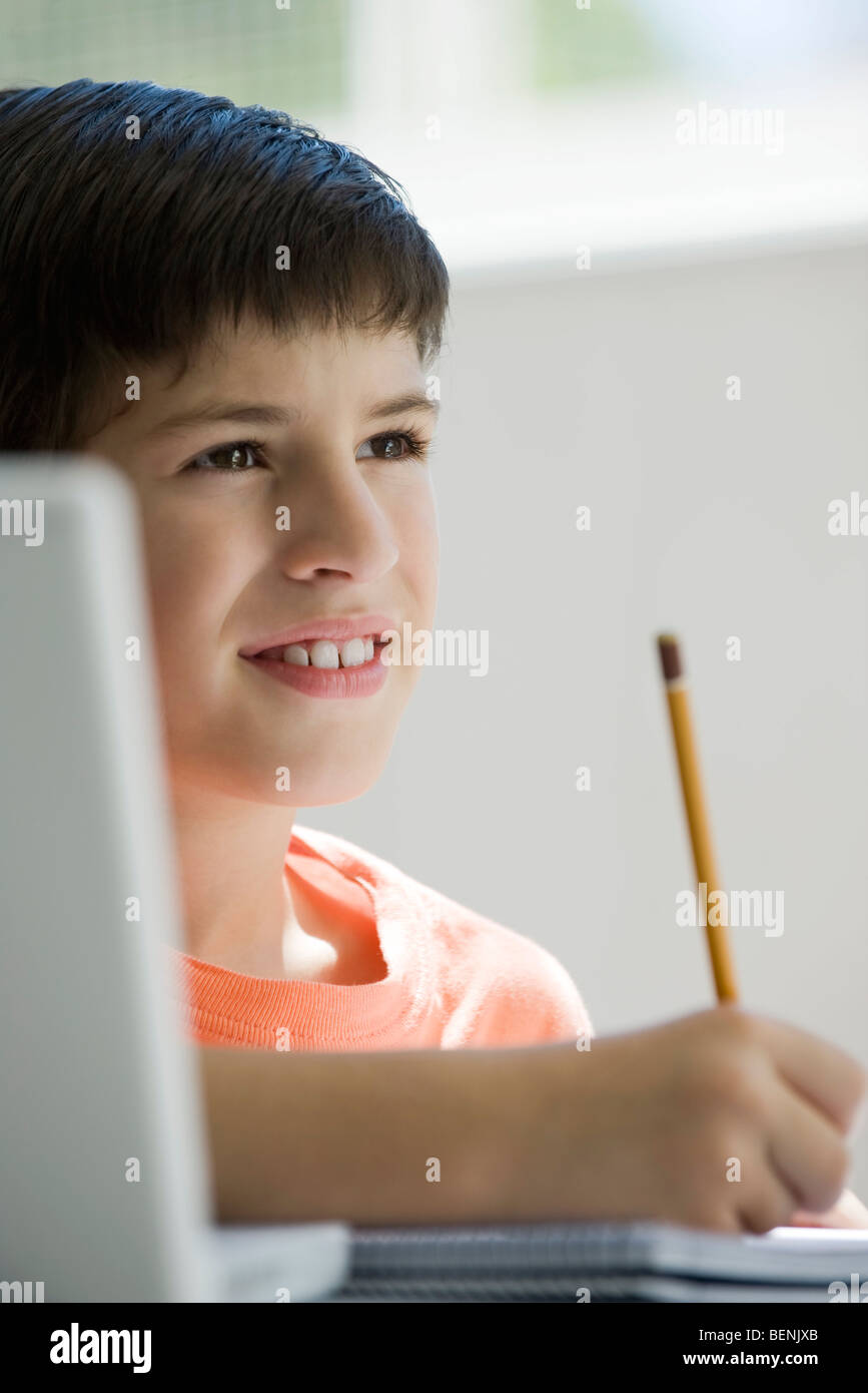 Three students sit writing hi-res stock photography and images - Alamy