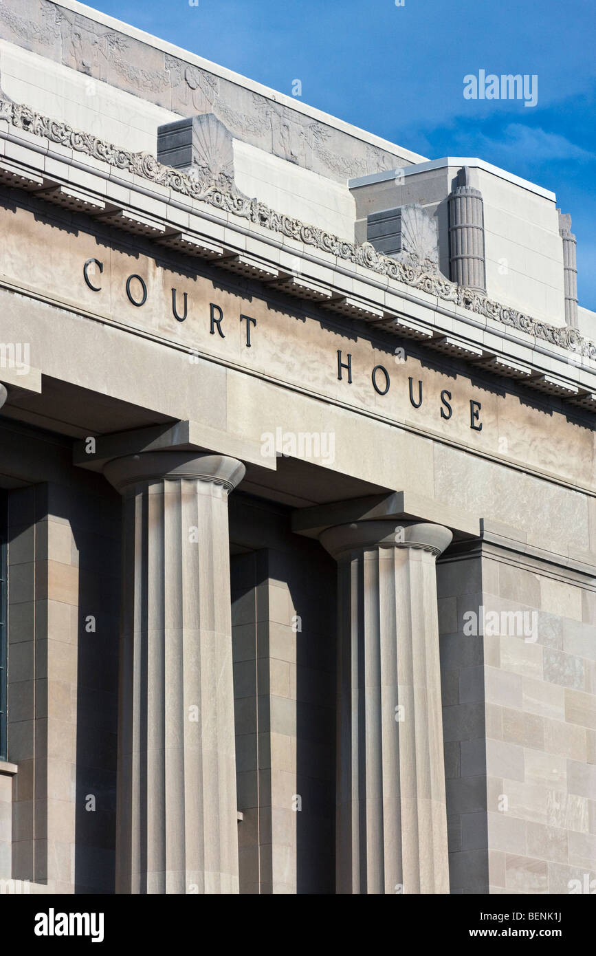 Detail of a stately, neoclassical courthouse building. See description ...